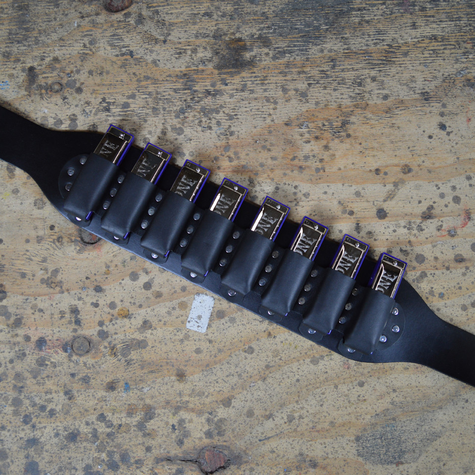 Leather hamonica belt. Can hold up to 8 harps. \n \n Buckle adjustable ...