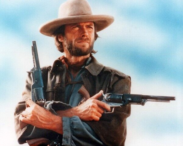 Clint Eastwood holds dual Colt Walker 1847's The Outlaw Josey Wales ...